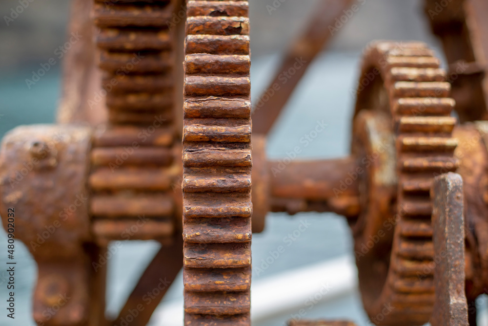 Details of a parts the moving parts of a rusty machine mechanical gear ...
