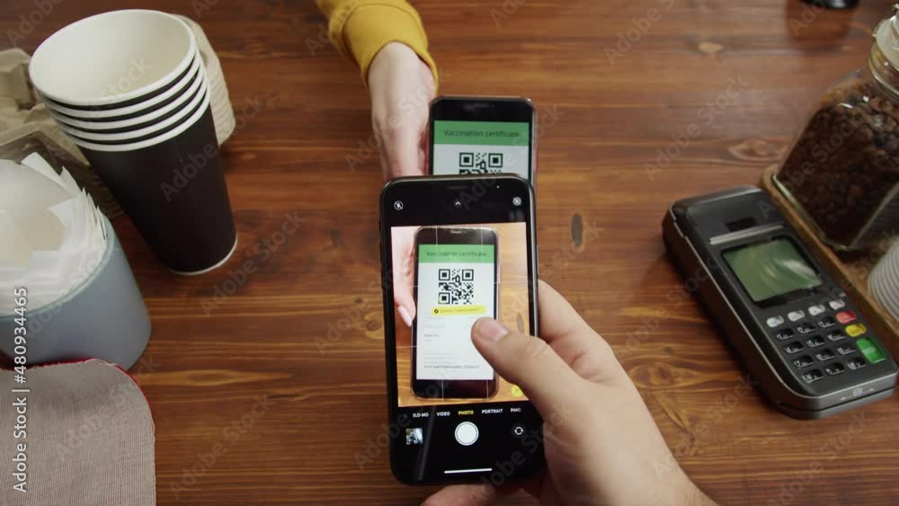 QR code, covid vaccination passport control close-up. Scanning ...