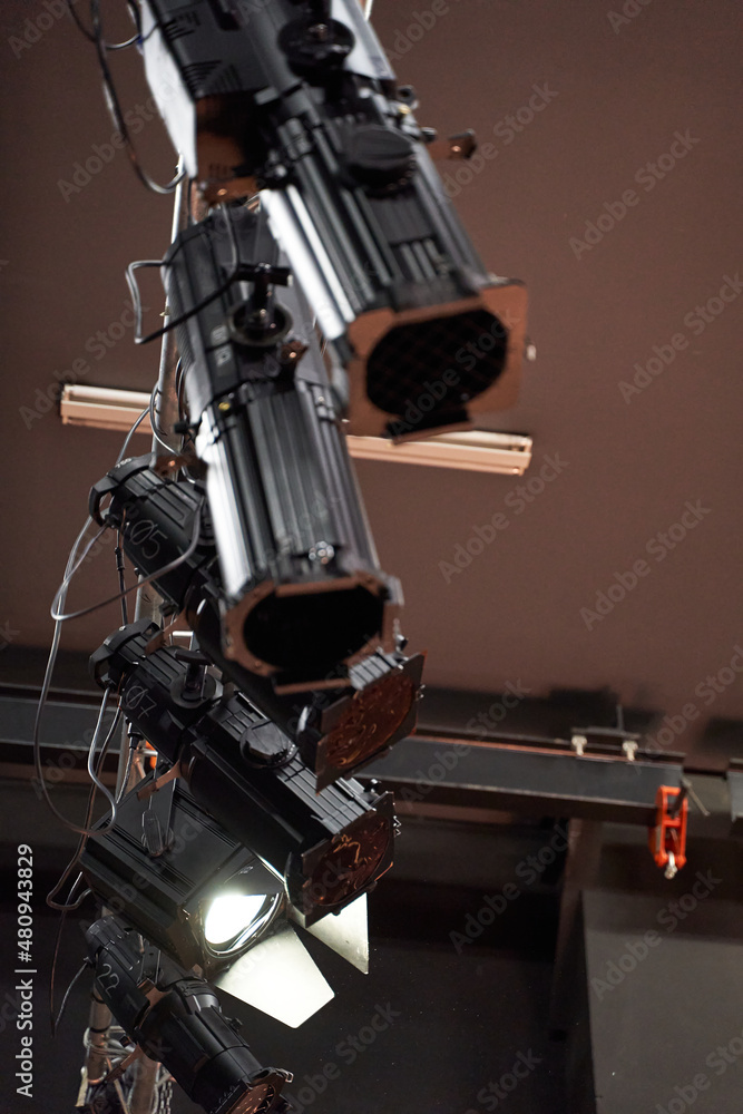 Series of theatre stage lights like fresnel and led in truss lighting ...