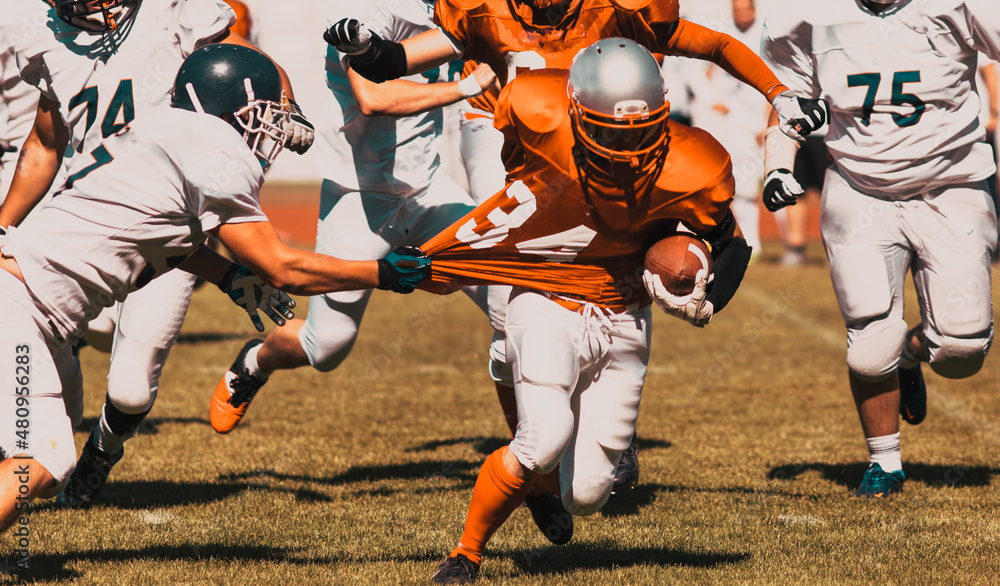 american football players fighting for the ball Stock Photo | Adobe Stock