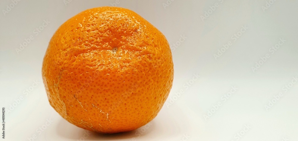 Ripe tangerine isolated close up. Citrus tangerine on a white ...