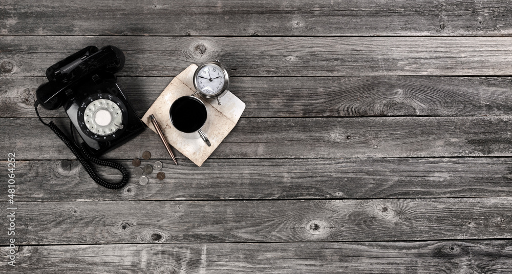 Old wood desk table with basic retro work items plus coffee in flat lay ...