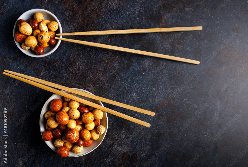 Senbei traditional Japanese snack in a bowl close-up. Rice crackers ...