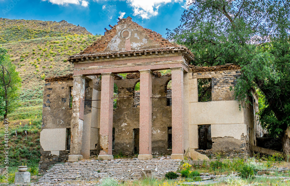 Destroyed and abandoned buildings of the city after the war, bombing or ...