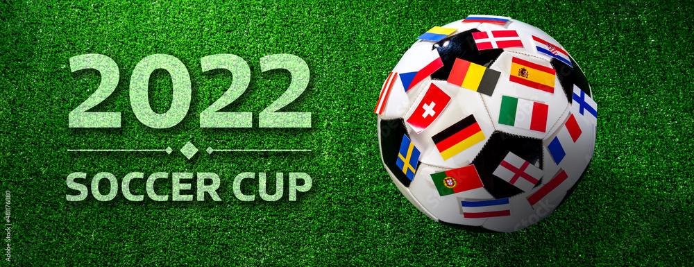 Soccer cup 2022 and football on grass with countries flags on it. Sport ...