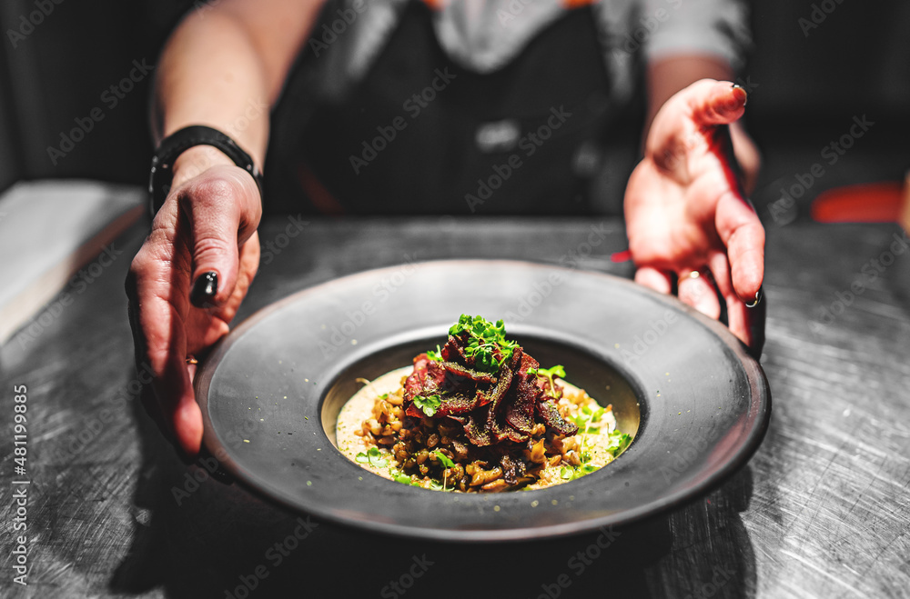 Hands Holding Plate Of Food