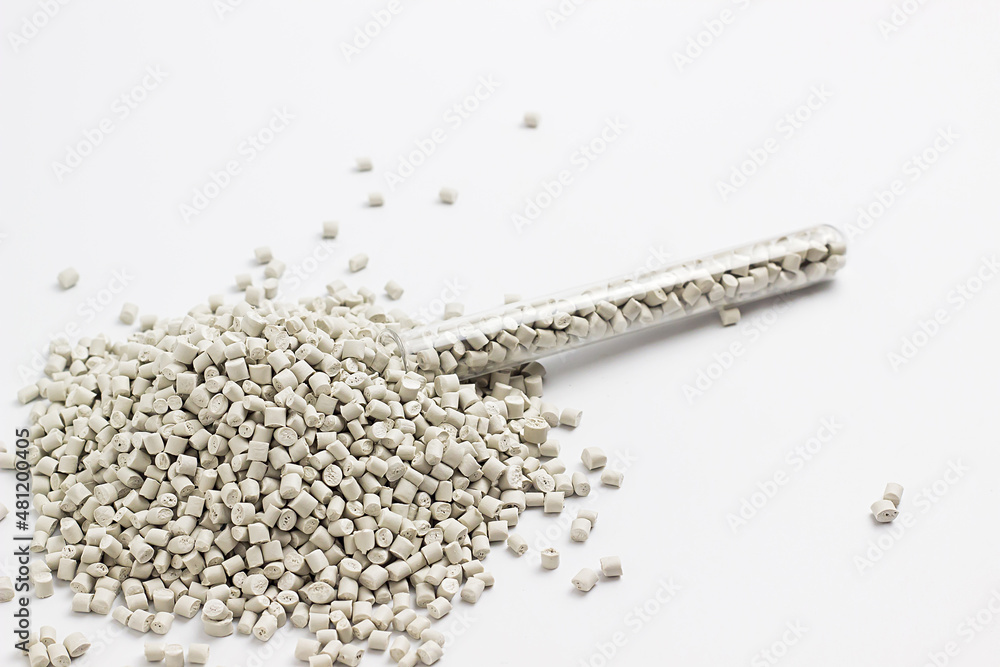 white granules of polypropylene, polyamide. White background. Plastic ...