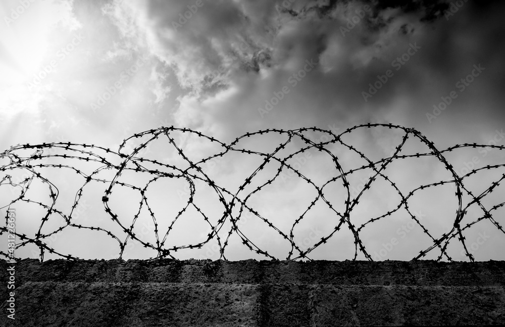 Prison. Prison wall with barbed wire. Law and justice Stock Photo ...