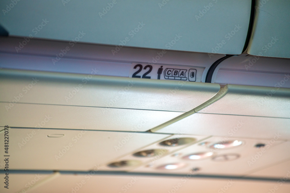 Typical passenger control panel above seats in airplane. Controls for ...