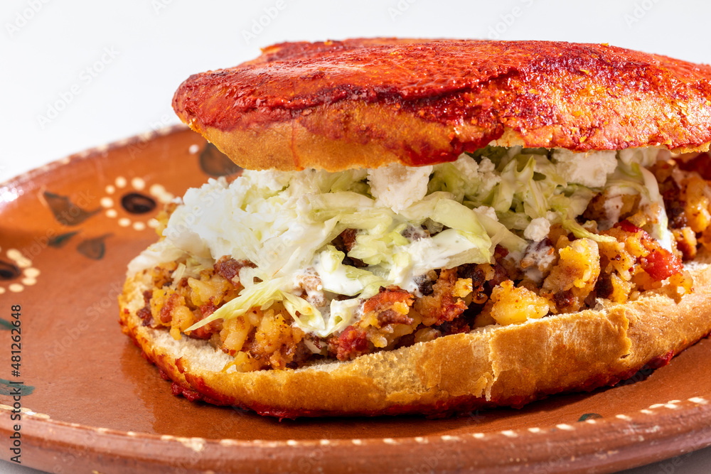 Pambazo, mexican street food meal. Pambazo is sandwich made of bread ...