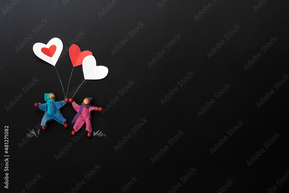 2 gender neutral characters holding heart balloons on a chalkboard ...