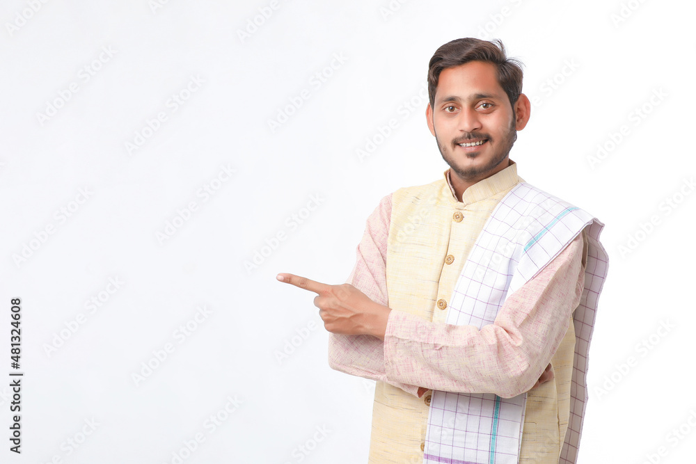 Young indian man in traditional wear and giving expression on white ...