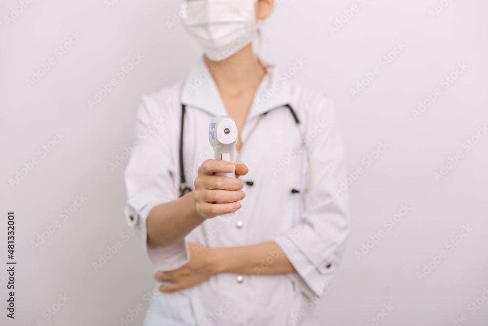 Temperature measurement gun in doctor hands. Close-up shot of doctor ...