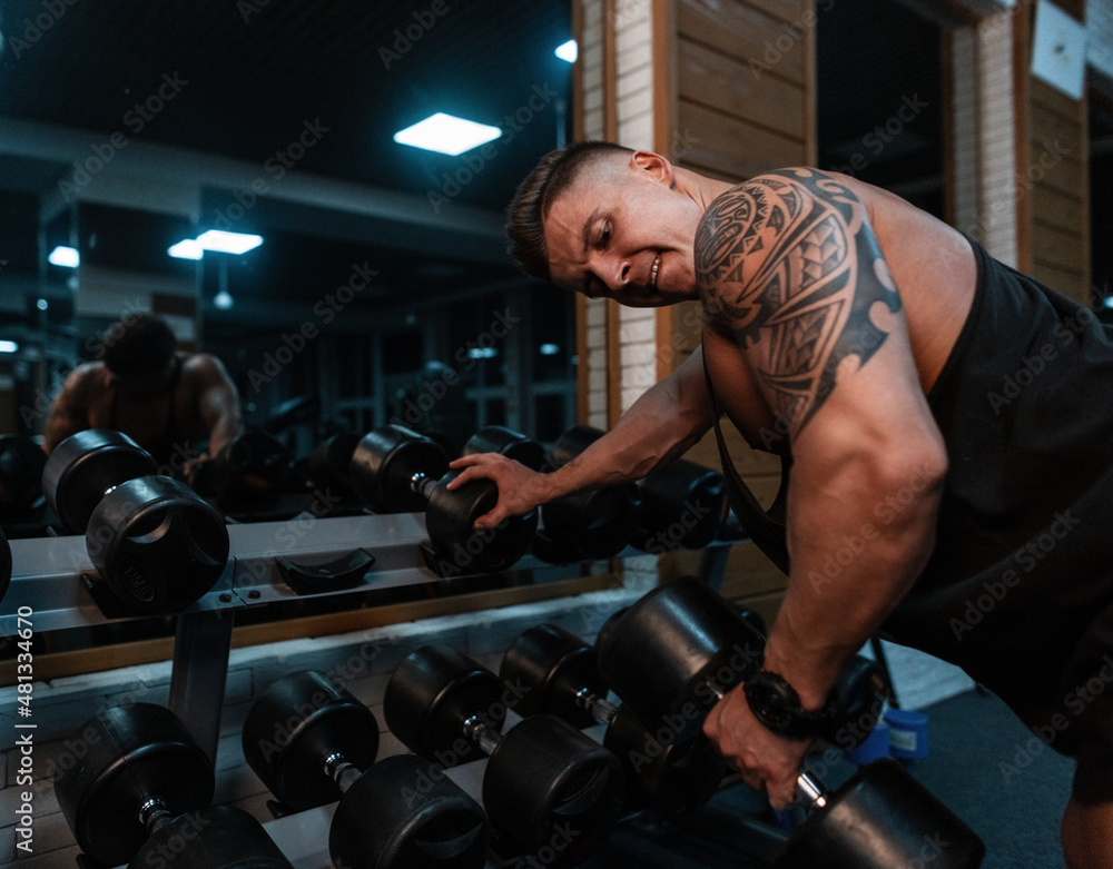 handsome sports man bodybuilder with a muscular body and a maya tattoo ...