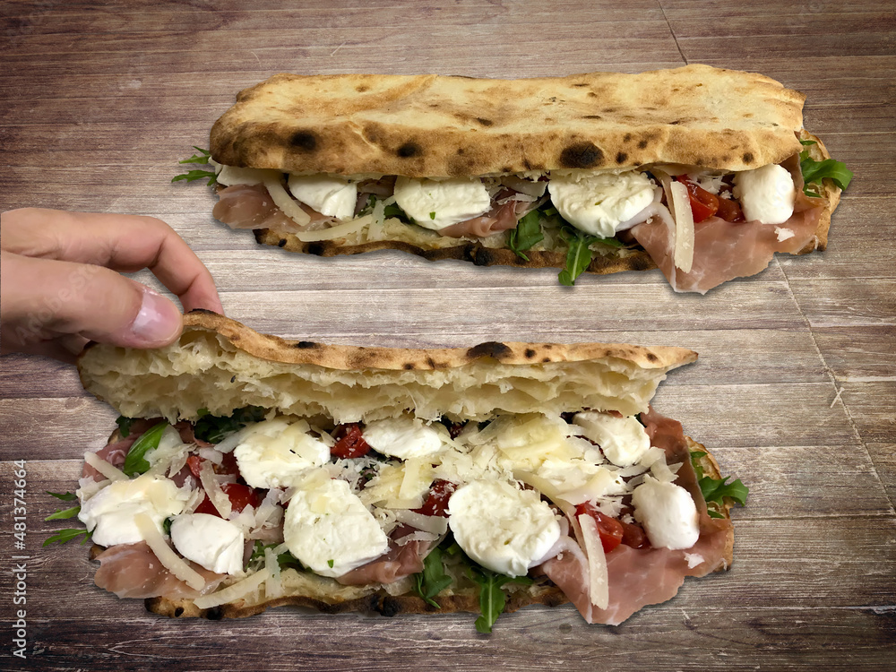 Neapolitan Panuozzo, with fresh and raw ingredients, mozzarella, tomato ...