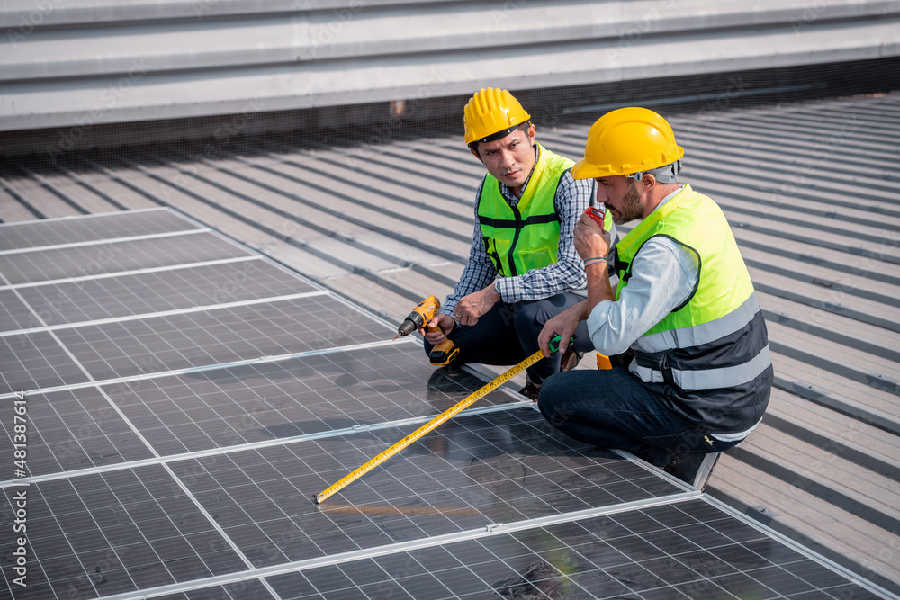 Engineer wearing unifrom and helmet inspect and check solar cell panel ...