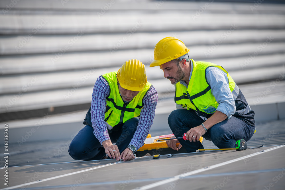 Engineer wearing unifrom and helmet inspect and check solar cell panel ...