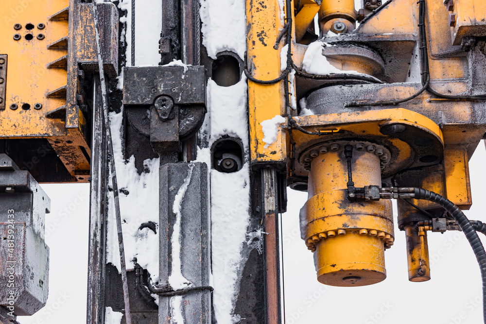 Powerful pile driving rig at the construction site. The mast of the ...