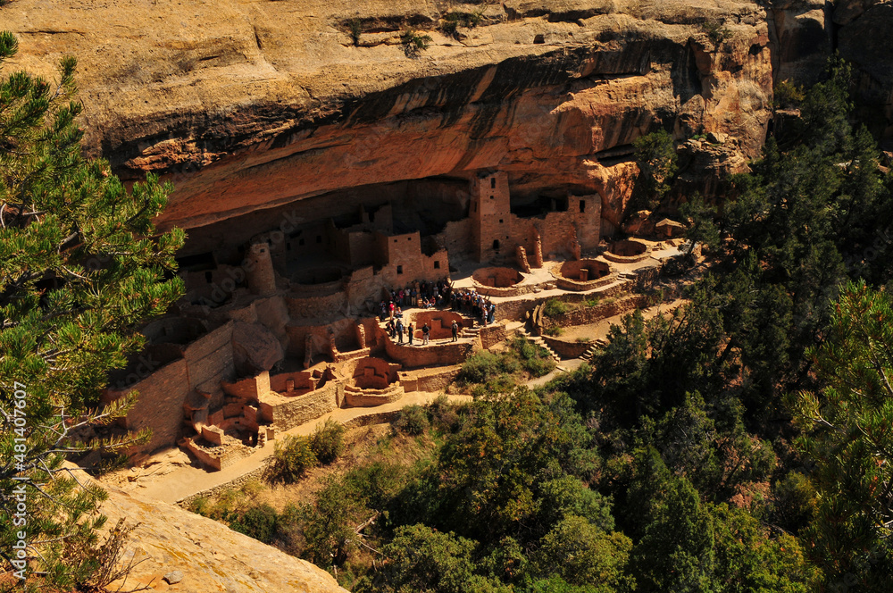 A group of tourists gather at the Cliff Palace, the largest Ancestral ...