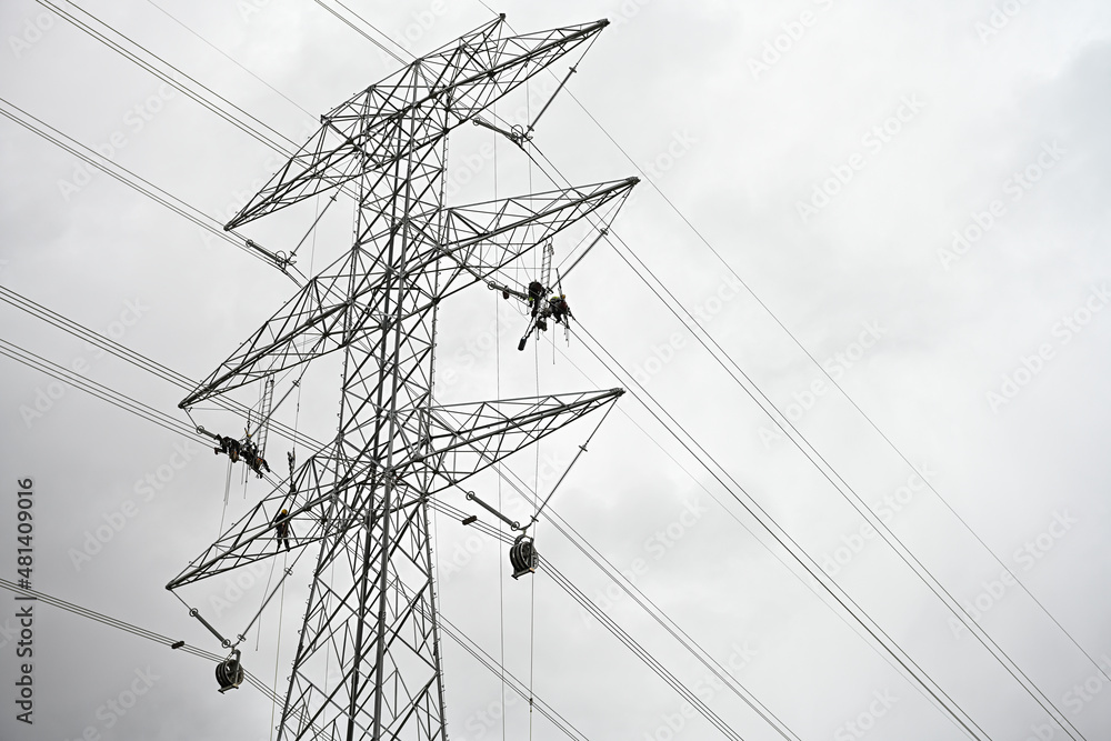 Installation and assembly of high-rise electrical towers. Stock Photo ...