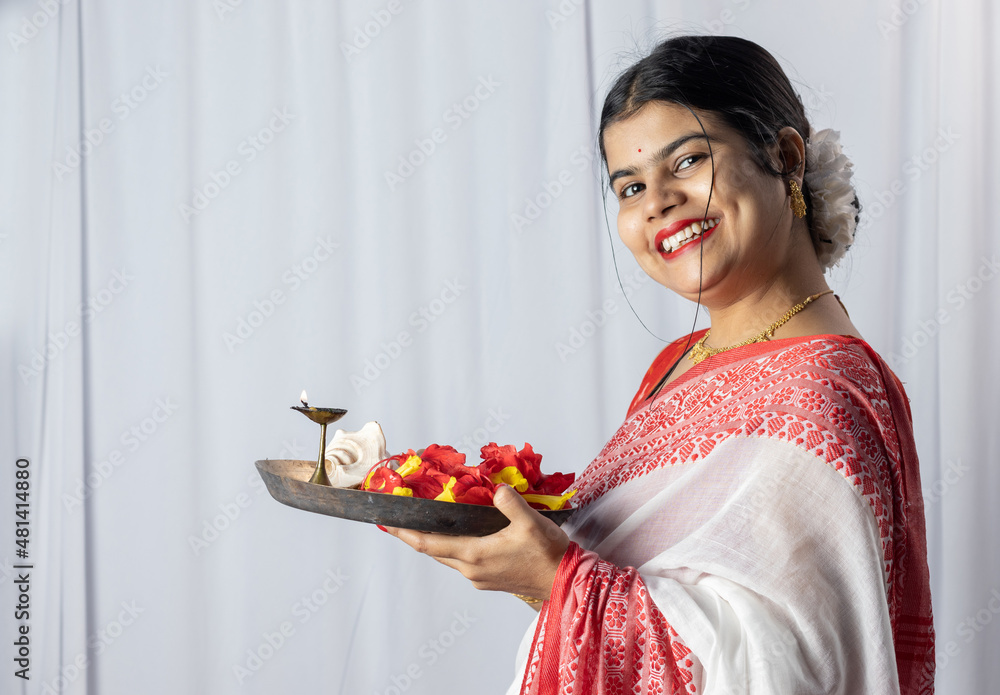 Religious Indian woman in saree Stock Photo | Adobe Stock
