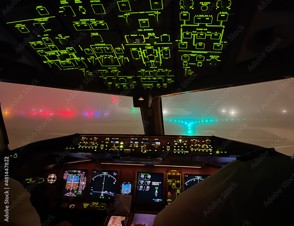 A large jet airliner during a low visibility taxi and takeoff. Stock ...