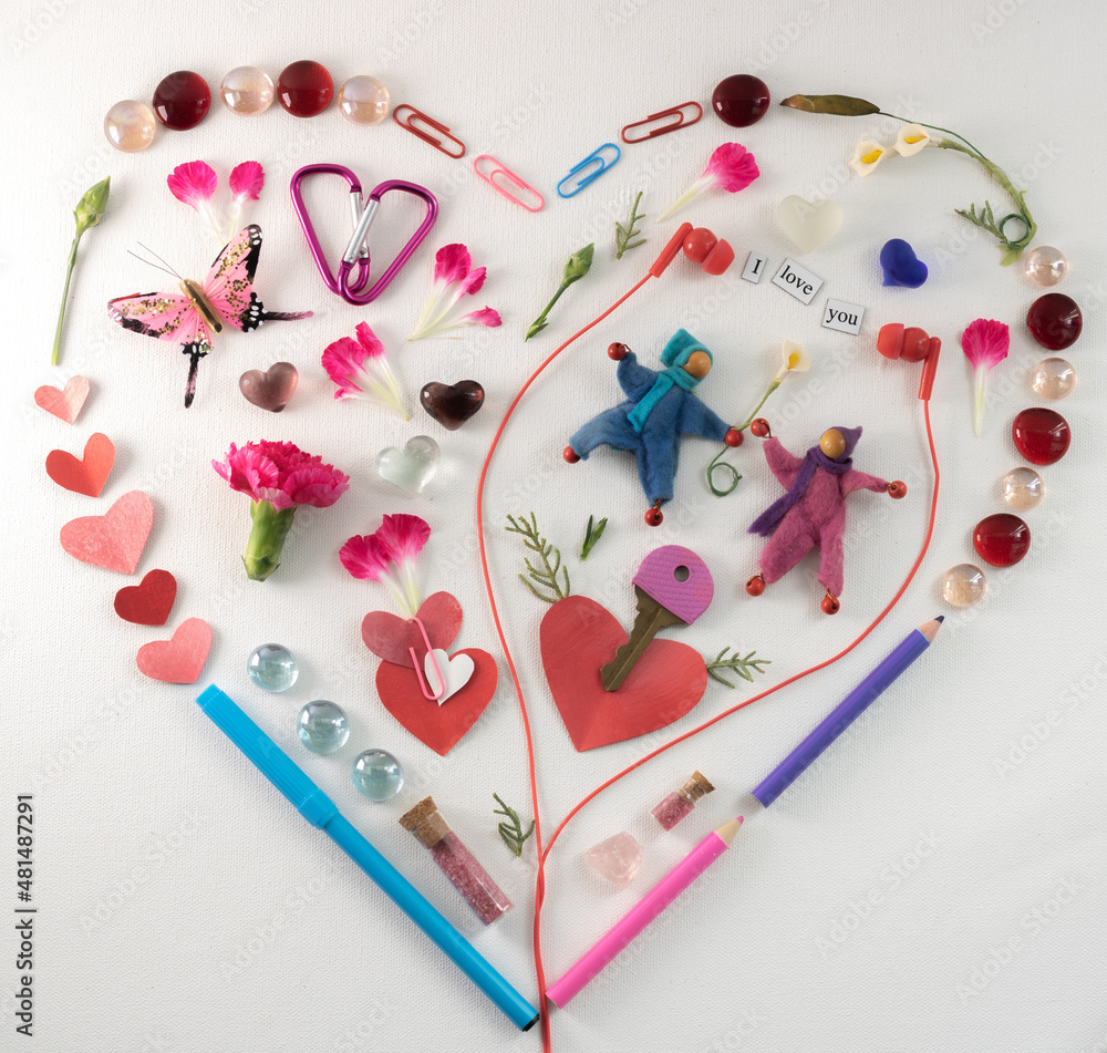 Heart shape lat design using office and art supplies, petals, butterfly ...