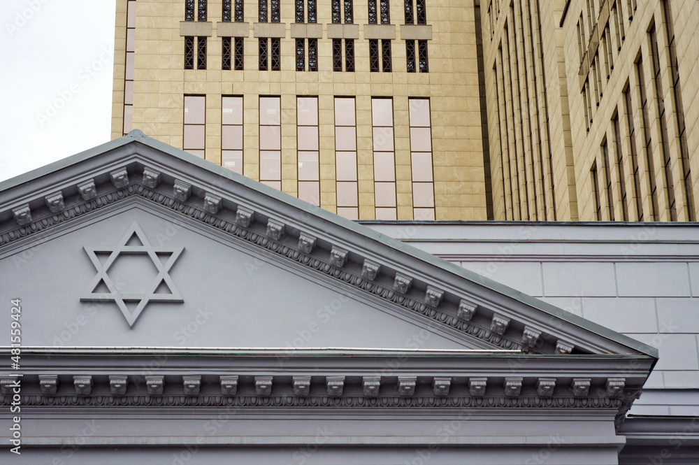 Part of the facade of the synagogue with the Star of David against the ...