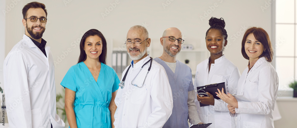 Happy clinic or hospital staff at work. Multiracial team of friendly ...