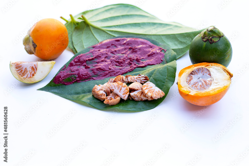 Chewing betel nut, Betel nut with red cal lime powder on betel leaves ...