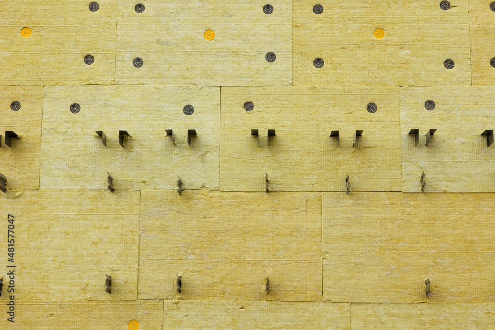 Wall insulation with mineral wool and installation of a hinged ...