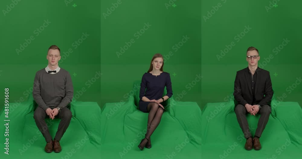 GREEN SCREEN CHROMA KEY Front view of Spectators wearing formal attire ...