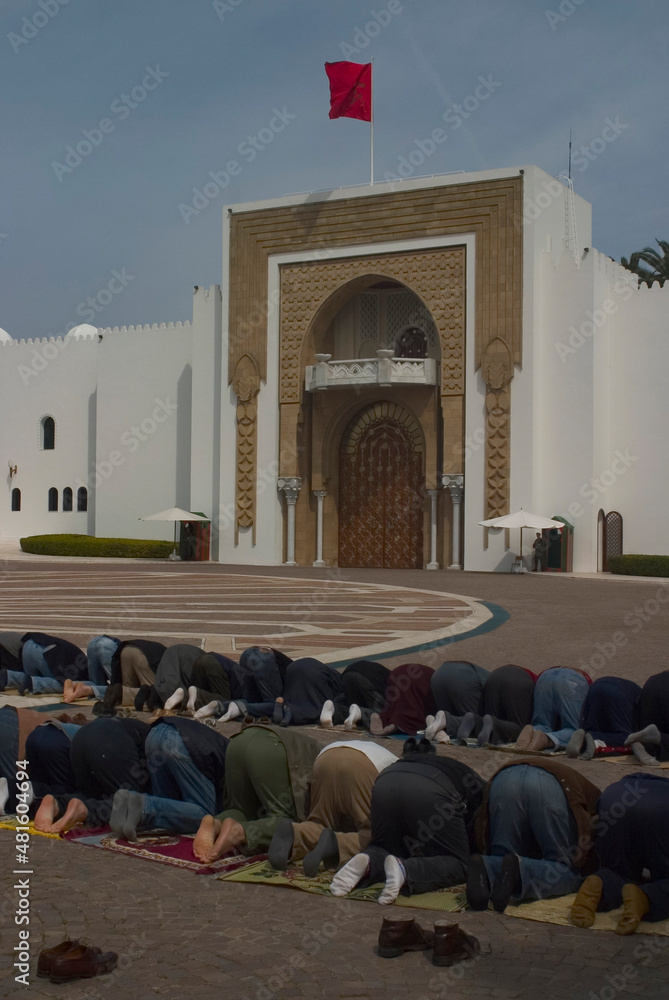 People praying at prayer time in front of the Palais Royal in Plaze El ...
