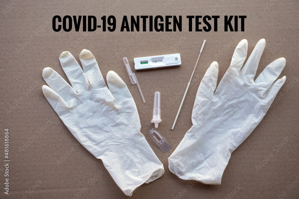 Stockfoto Rubber medical protective gloves and covid-19 virus antigen ...