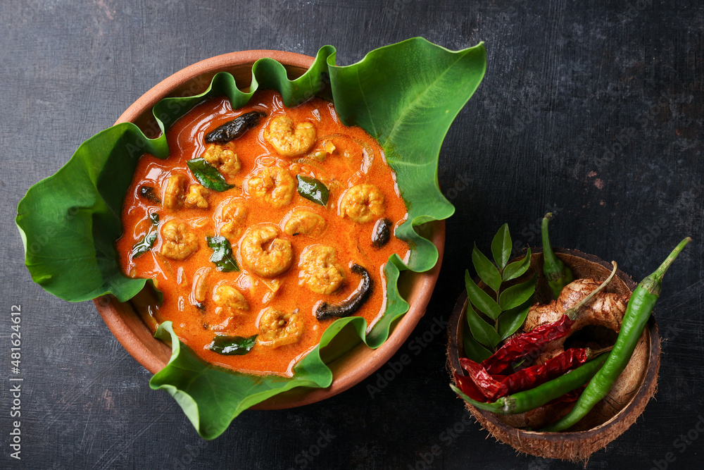 Serving Shrimp masala fish curry Chemmeen curry in coconut milk tiger ...