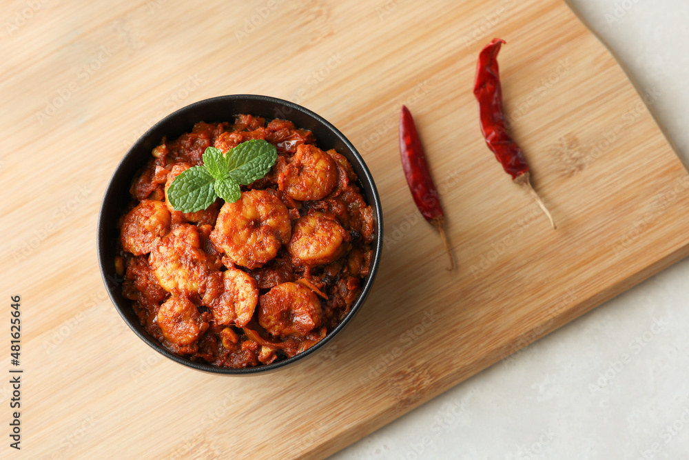 Top view spicy hot Prawn roast shrimp fry masala fish curry. Indian ...