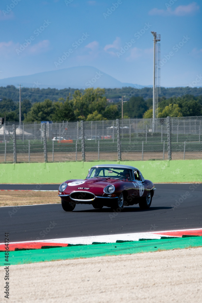 60s vintage race car competition on racetrack, Jaguar E type 3.8 Stock ...