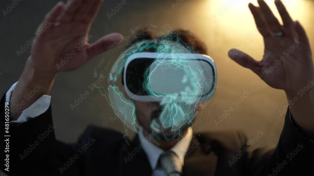 Asian Businessman wearing and using VR virtual reality goggle and ...