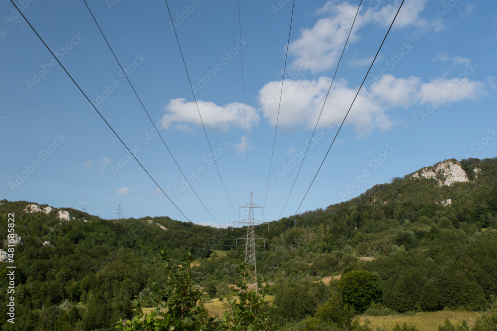 Transmission tower of high voltage overhead power lines in the middle ...