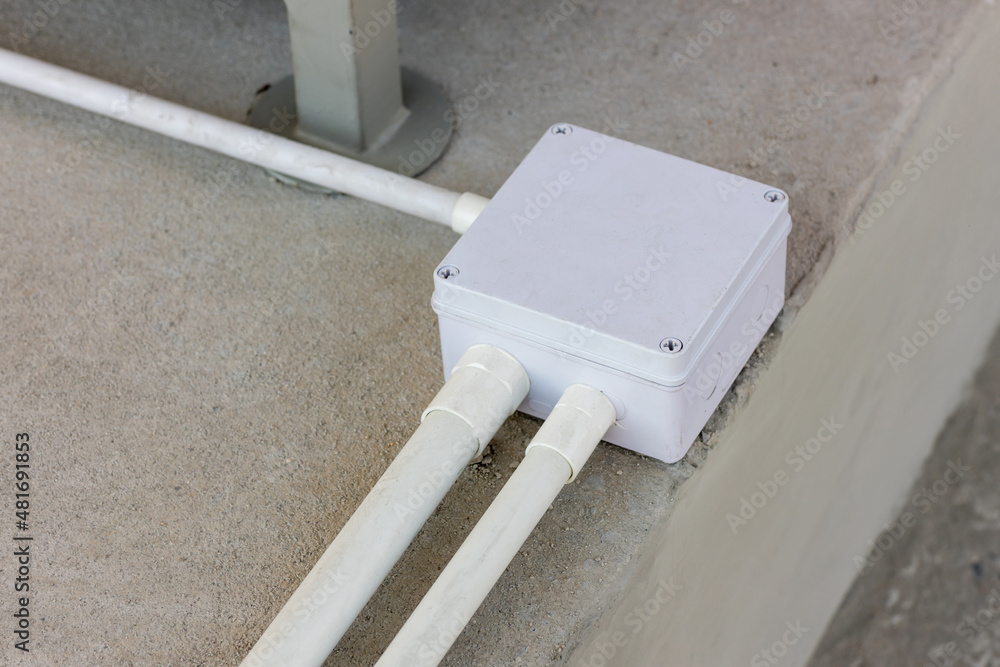 Square Flooring box with plastic pipes and electric cables. White ...