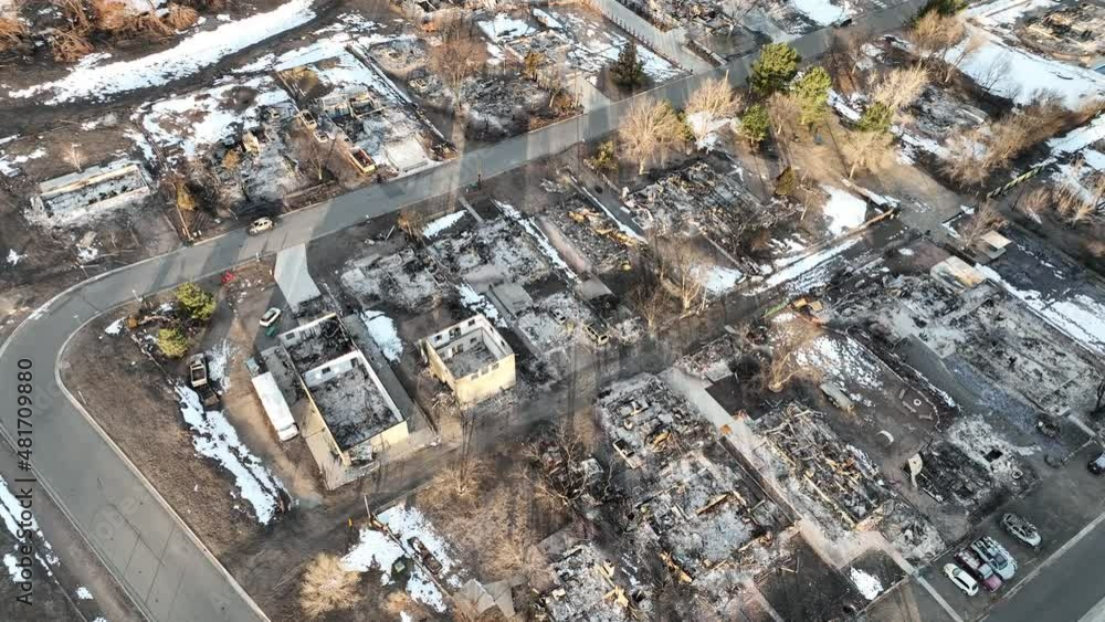 Aerial view of a whole neighborhood of houses burned down in a wildfire ...