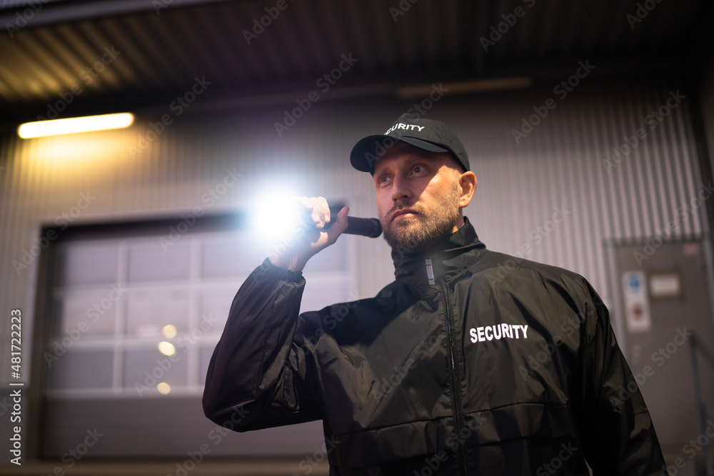 Security Guard Walking Building Perimeter With Flashlight Stock Photo ...