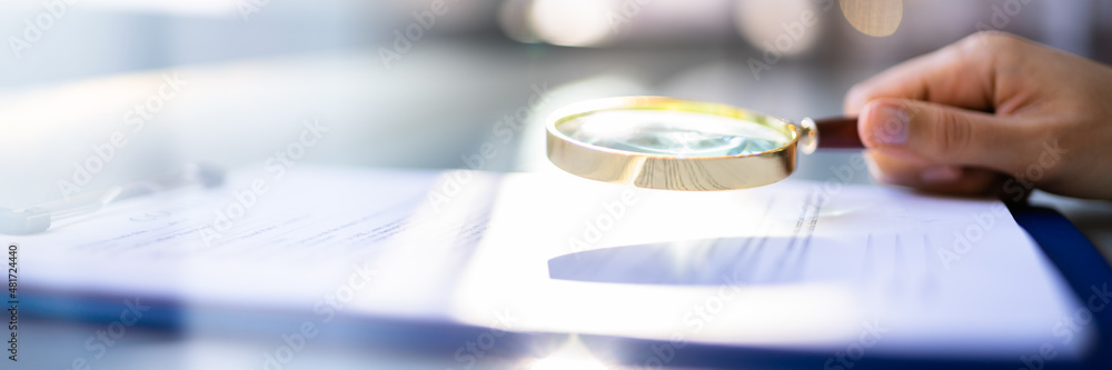 Audit And Fraud Investigation. Auditor Using Magnifying Glass Stock ...