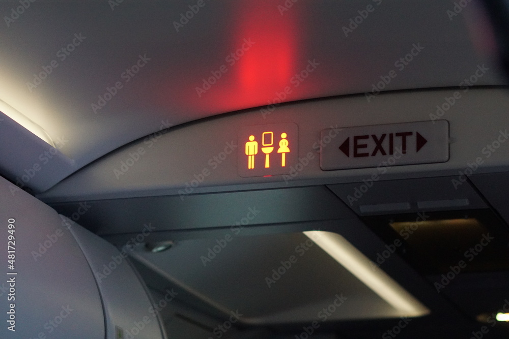 Occupied WC signs in a plane Stock Photo | Adobe Stock