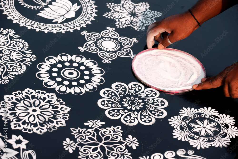 Indian Seller Man making rangoli from design patterns of Rangoli with ...