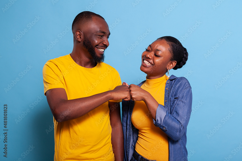 Foto de Happy partners doing fist bump gesture in agreement ...