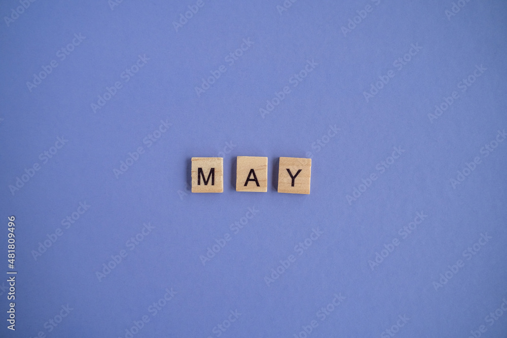 The name of the month MAY is written on wooden isolated cubes. Very ...