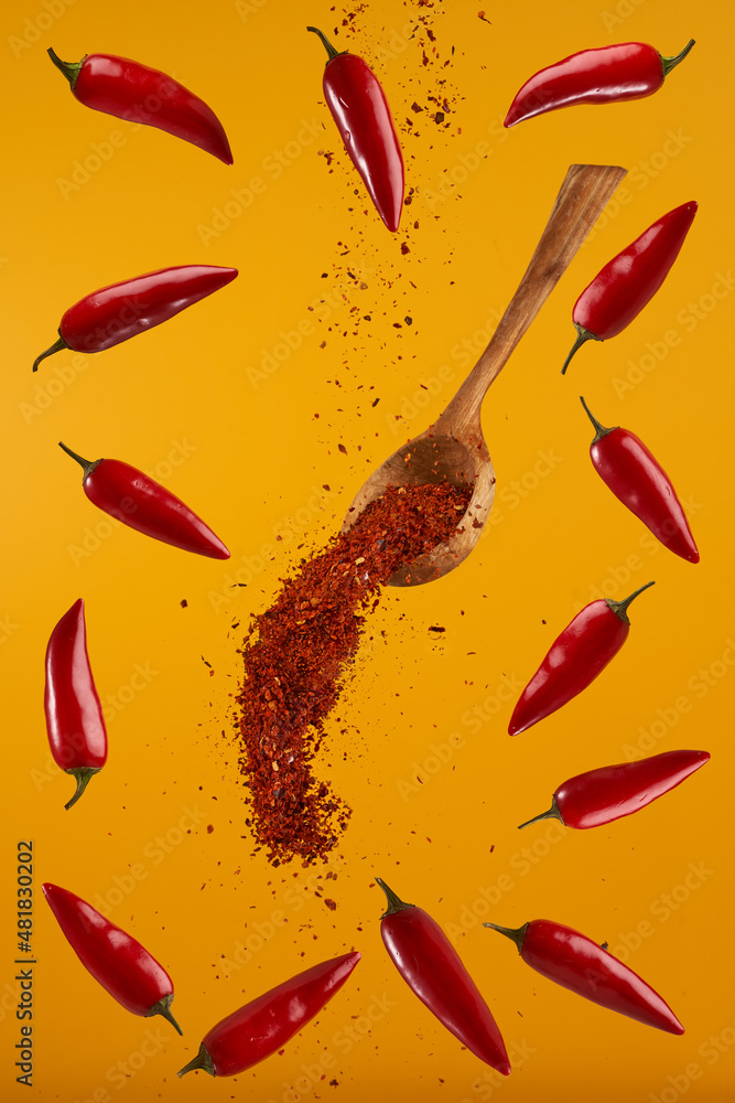 Flying hot chili and flakes Stock Photo | Adobe Stock