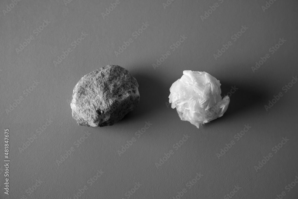 Rock and crumpled paper ball Stock Photo | Adobe Stock