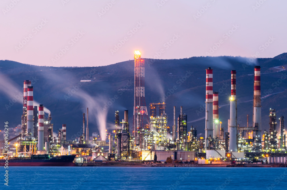 Petroleum Refinery Plant with sunset landscape. Refinery on coast. Oil ...
